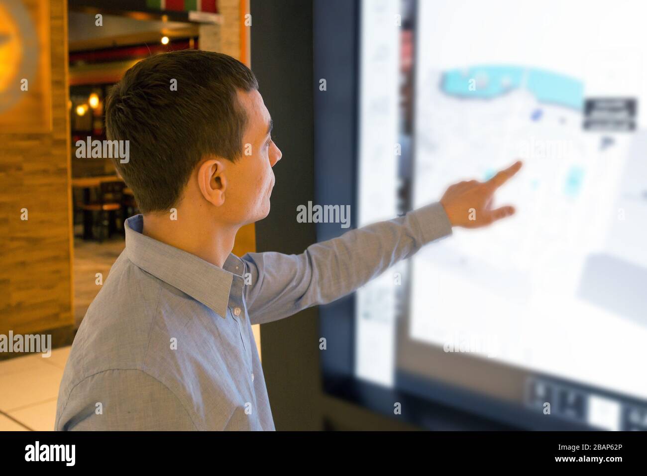 An adult male buyer of a large shopping center is looking for the right ...