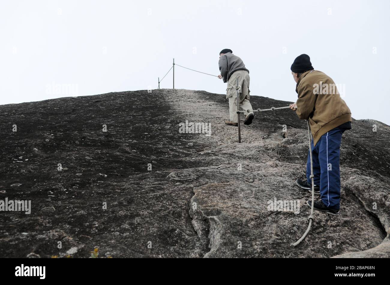 Petrópolis, Brazil, March 13, 2020. Men climbing the Cabo rock at ...
