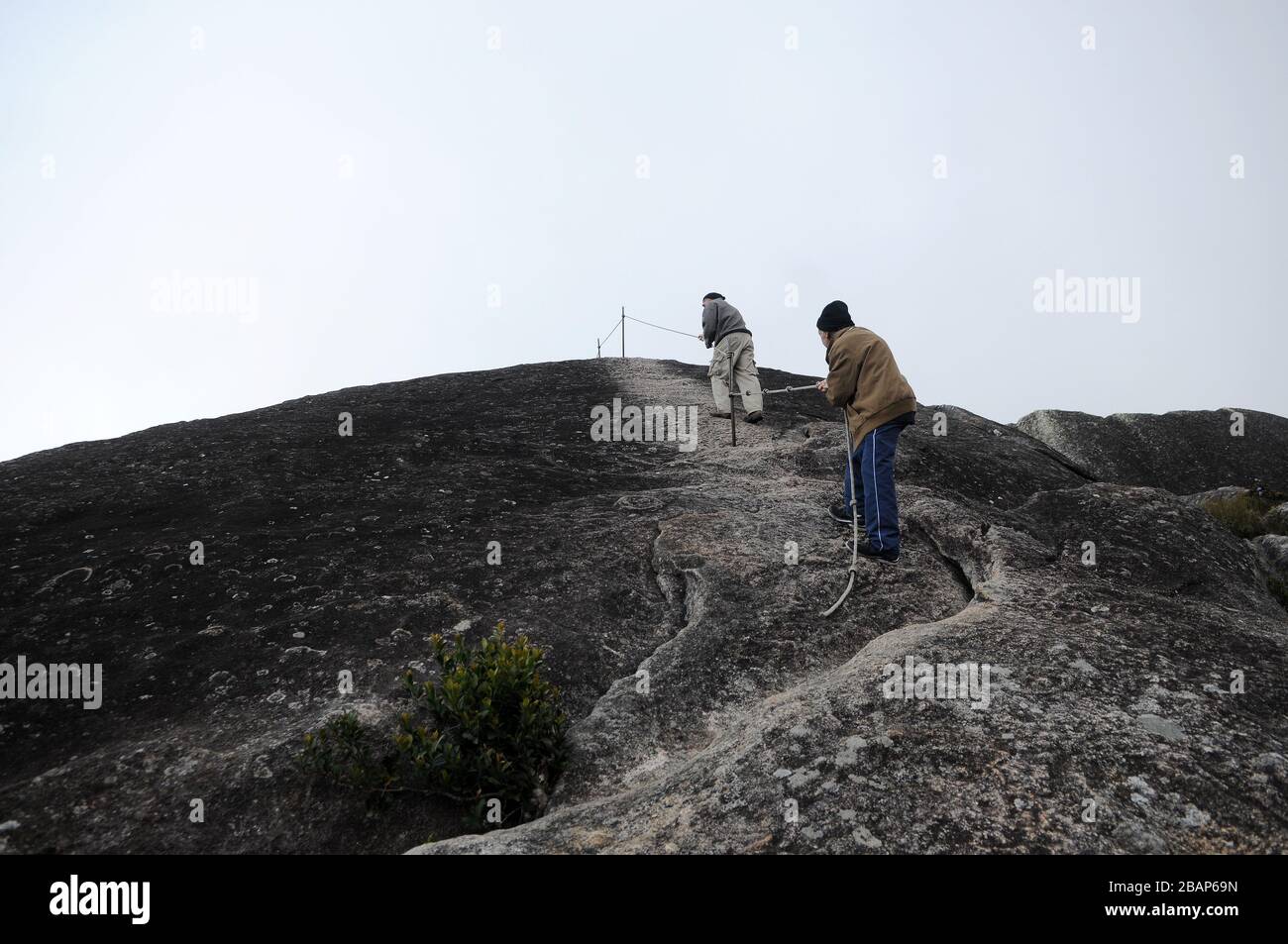Petrópolis, Brazil, March 13, 2020. Men climbing the Cabo rock at ...