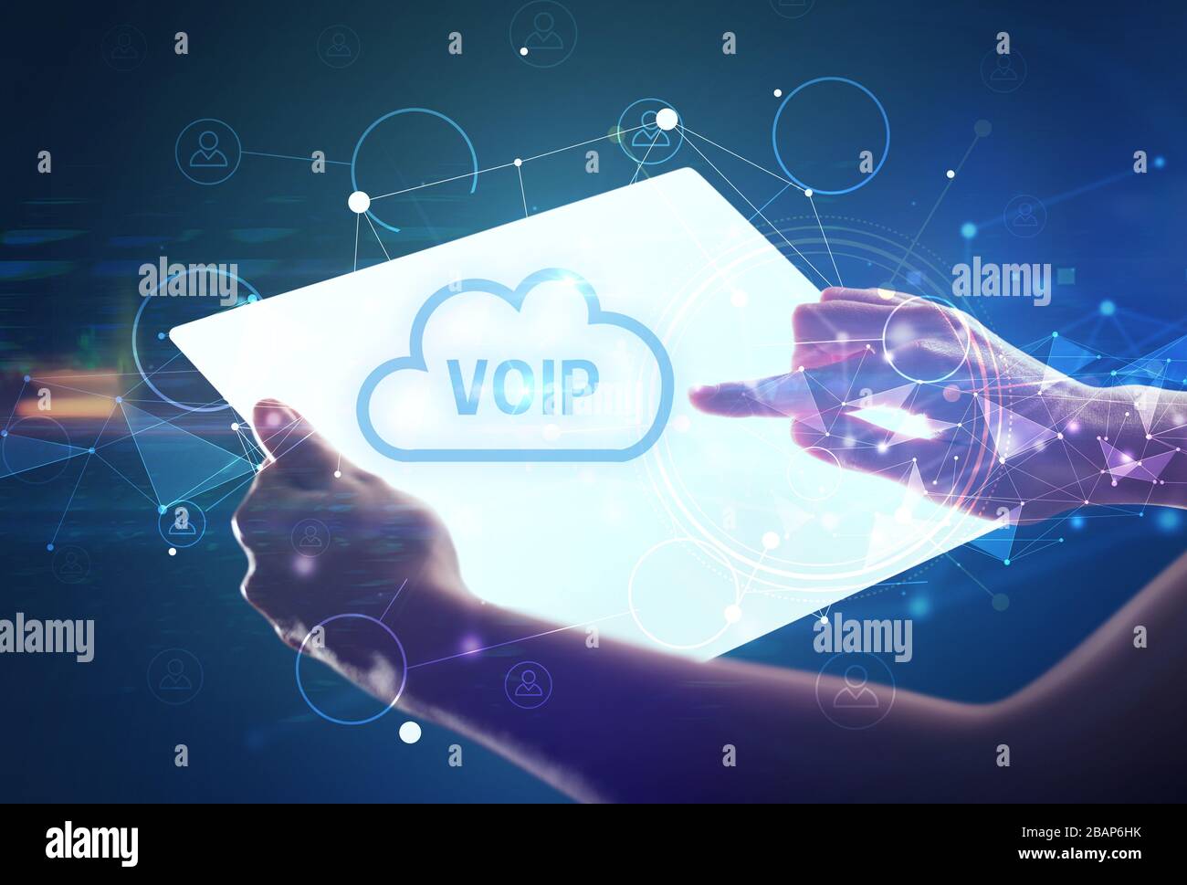 Hand holdig futuristic tablet with VOIP inscription, modern technology ...