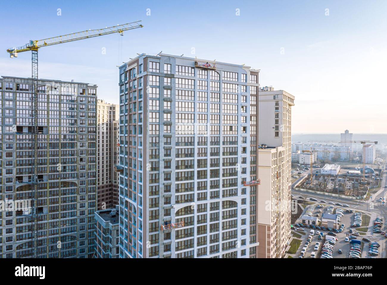 aerial view of city construction site with crane and buildings ...