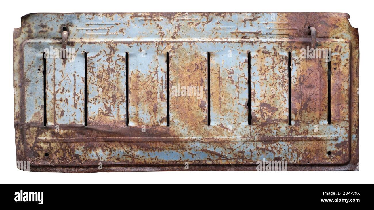 Crumpled rusty metal sheet that covers the diesel engine of a retro ...