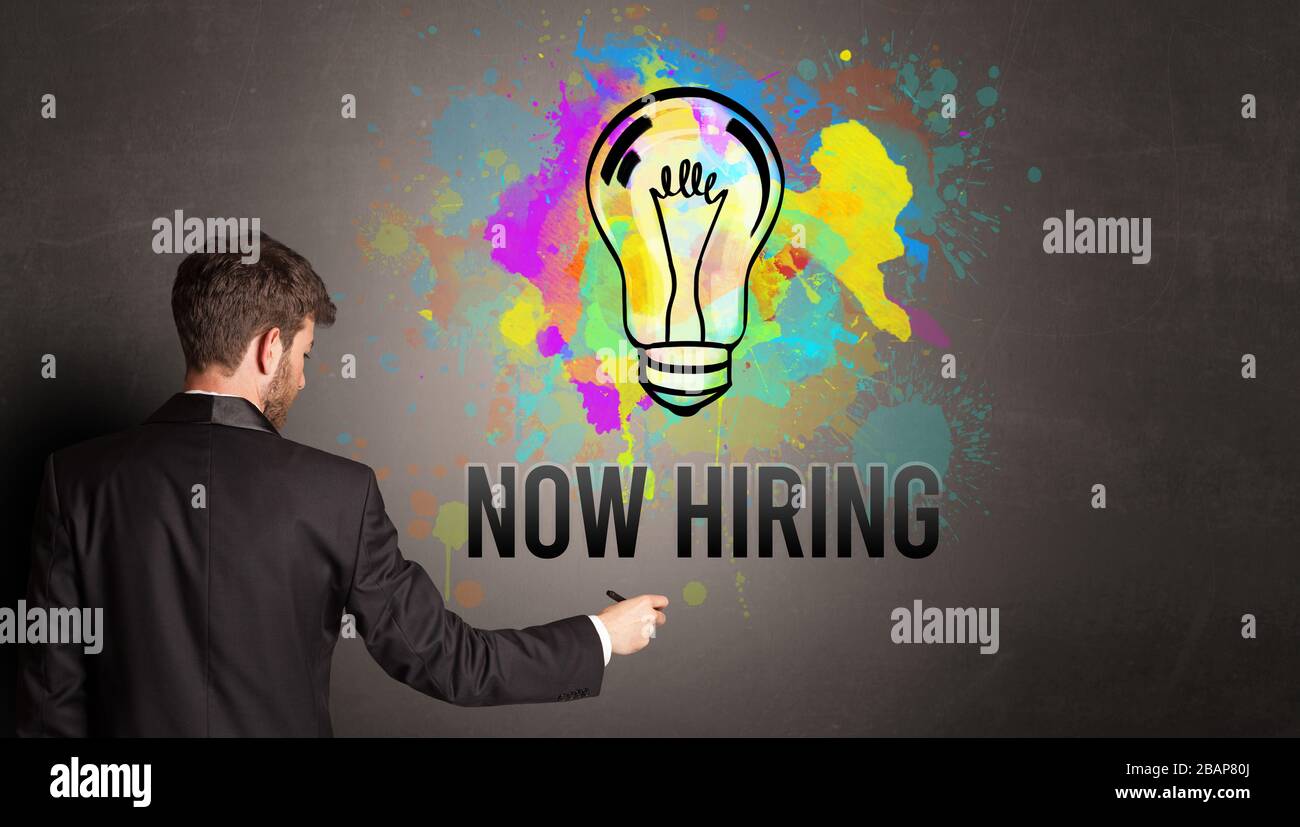 businessman drawing colorful light bulb with NOW HIRING inscription on ...