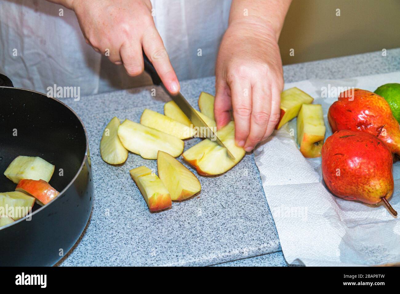 Miami Beach Florida,kitchen,making fruit fruits compote,apples,pears ...