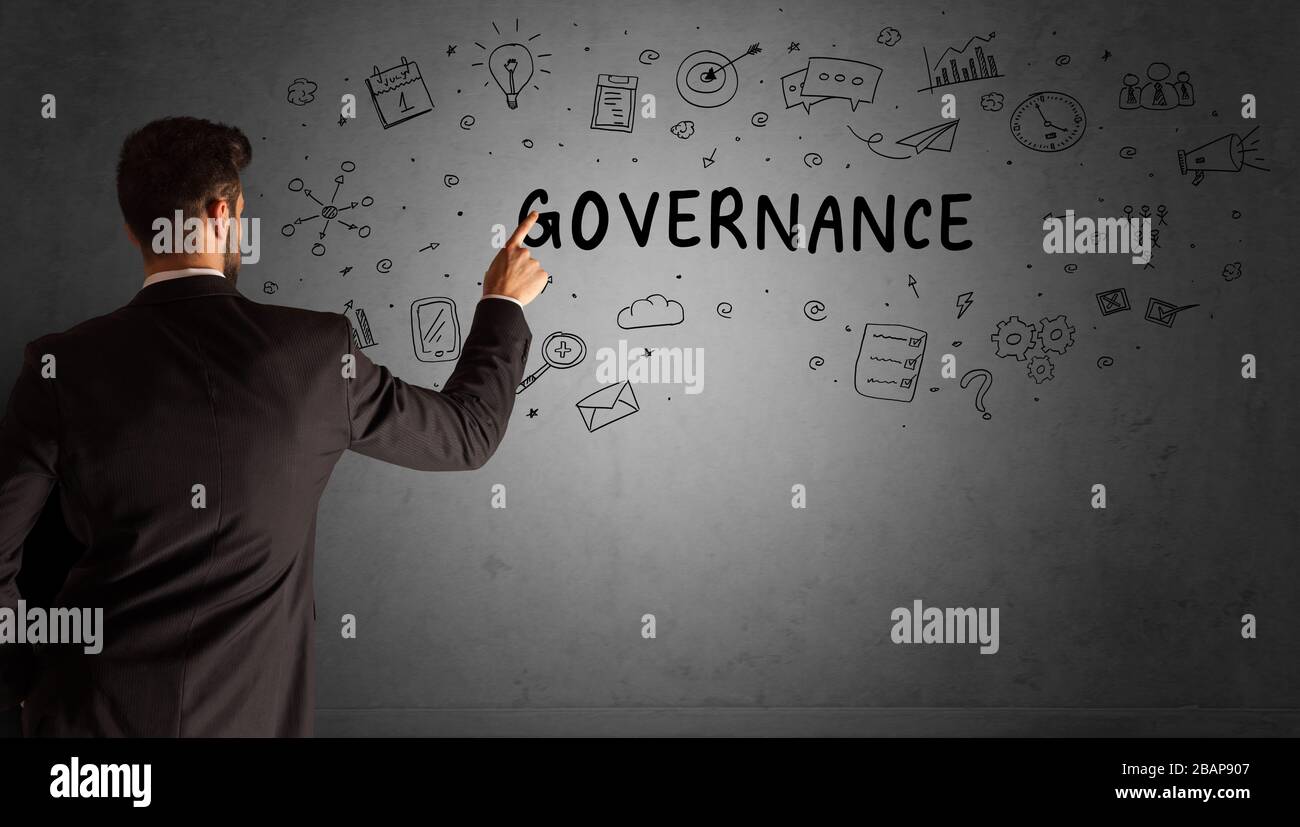 businessman drawing a creative idea sketch with GOVERNANCE inscription ...
