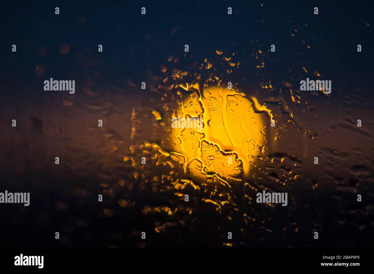 The sun in the rain. Raindrops on glass and sunset Stock Photo - Alamy