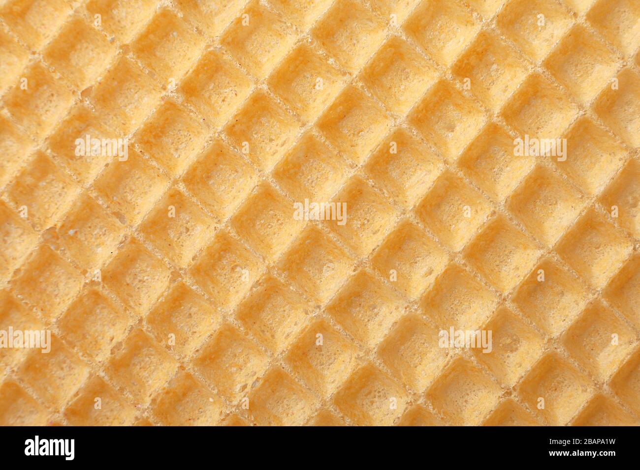 Yellow waffles surface closeup detail background Stock Photo - Alamy