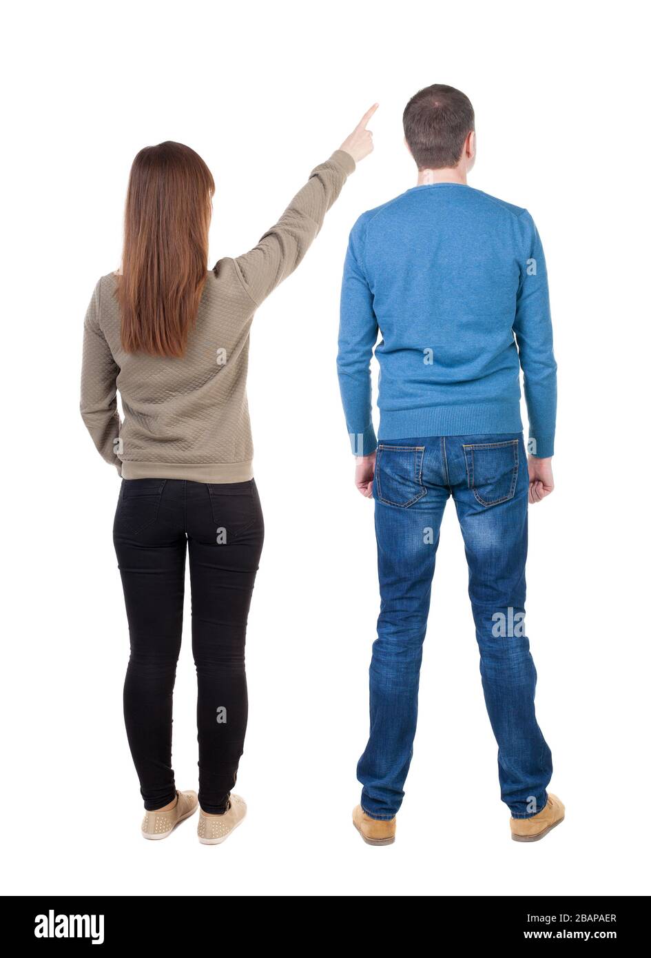 Back view of couple in sweater pointing. Rear view people collection ...