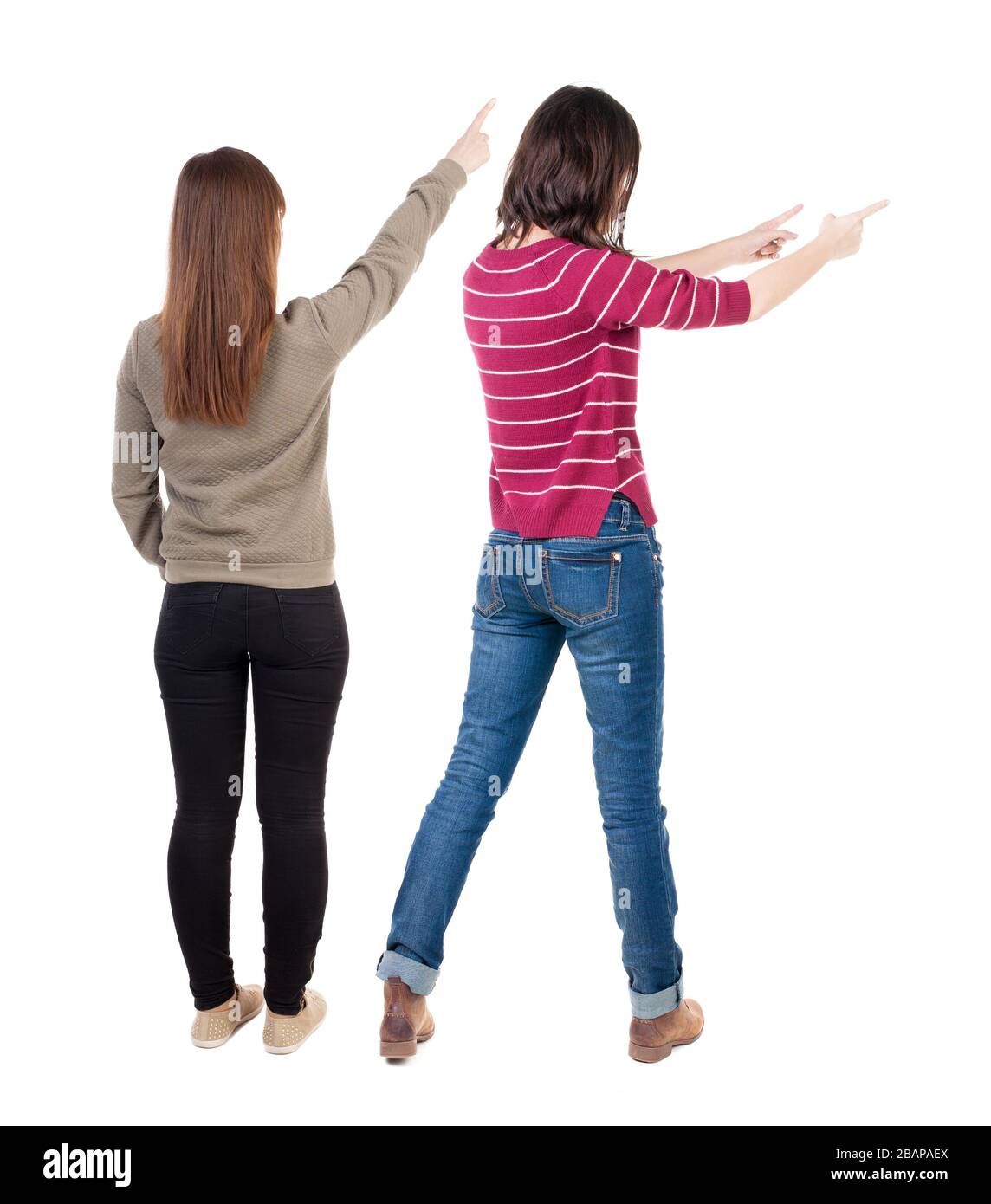 Back view of two pointing girl in sweater. Rear view people collection ...