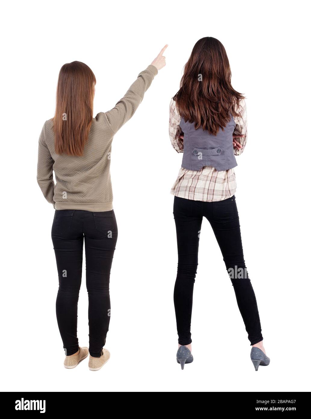Back view of two pointing girl in sweater. Rear view people collection ...