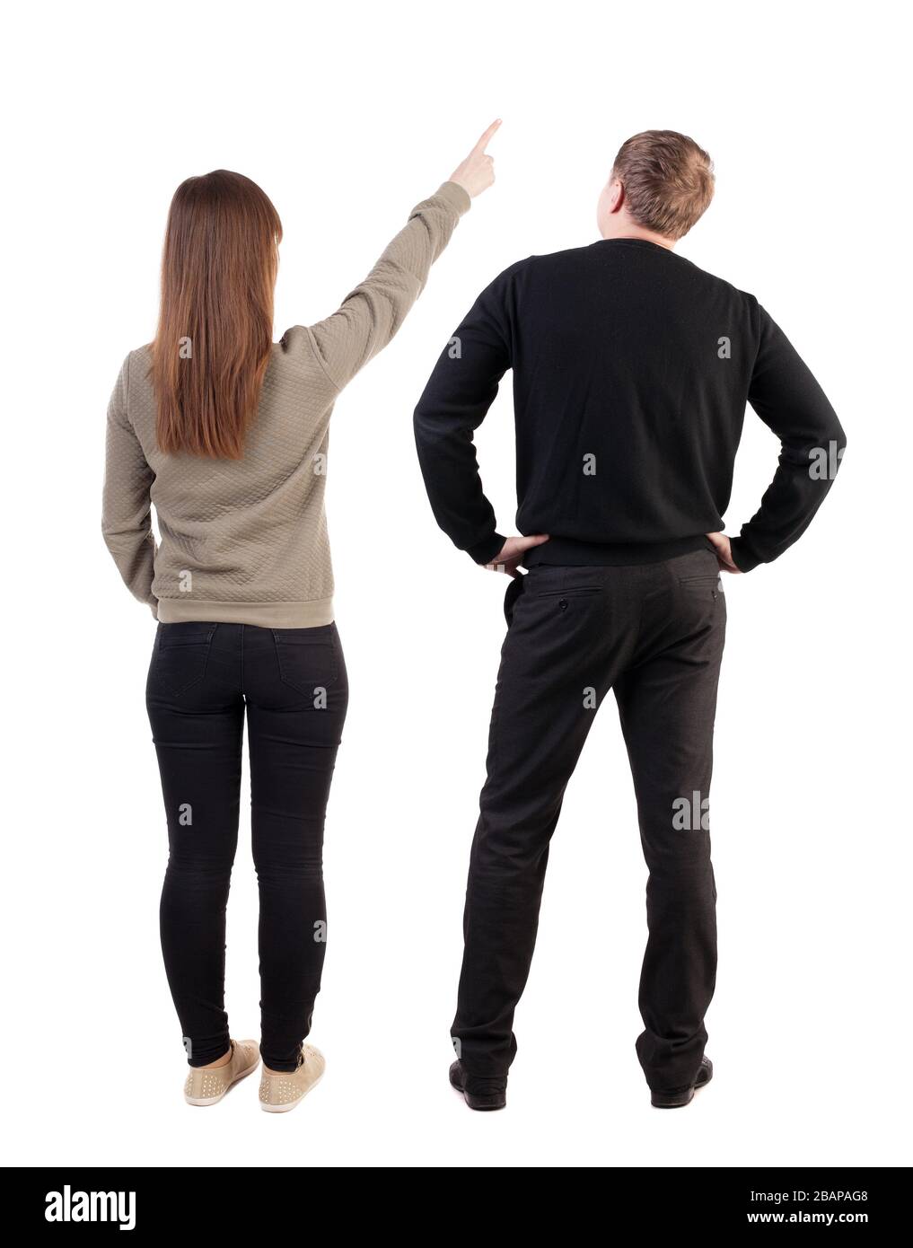 Back view of couple in sweater pointing. Rear view people collection ...