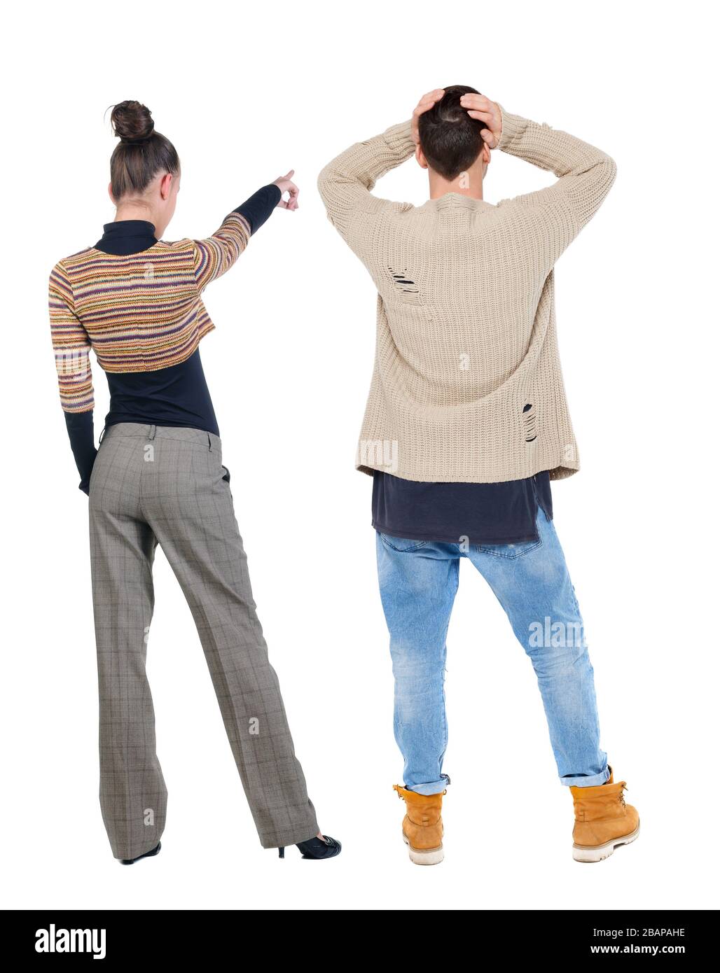 Back view of couple in sweater pointing. Rear view people collection ...