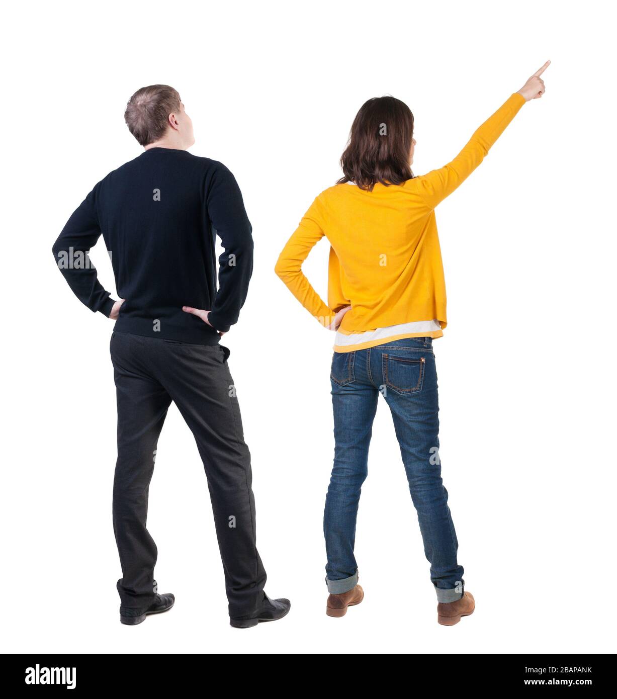 Back view of couple in sweater pointing. Rear view people collection ...