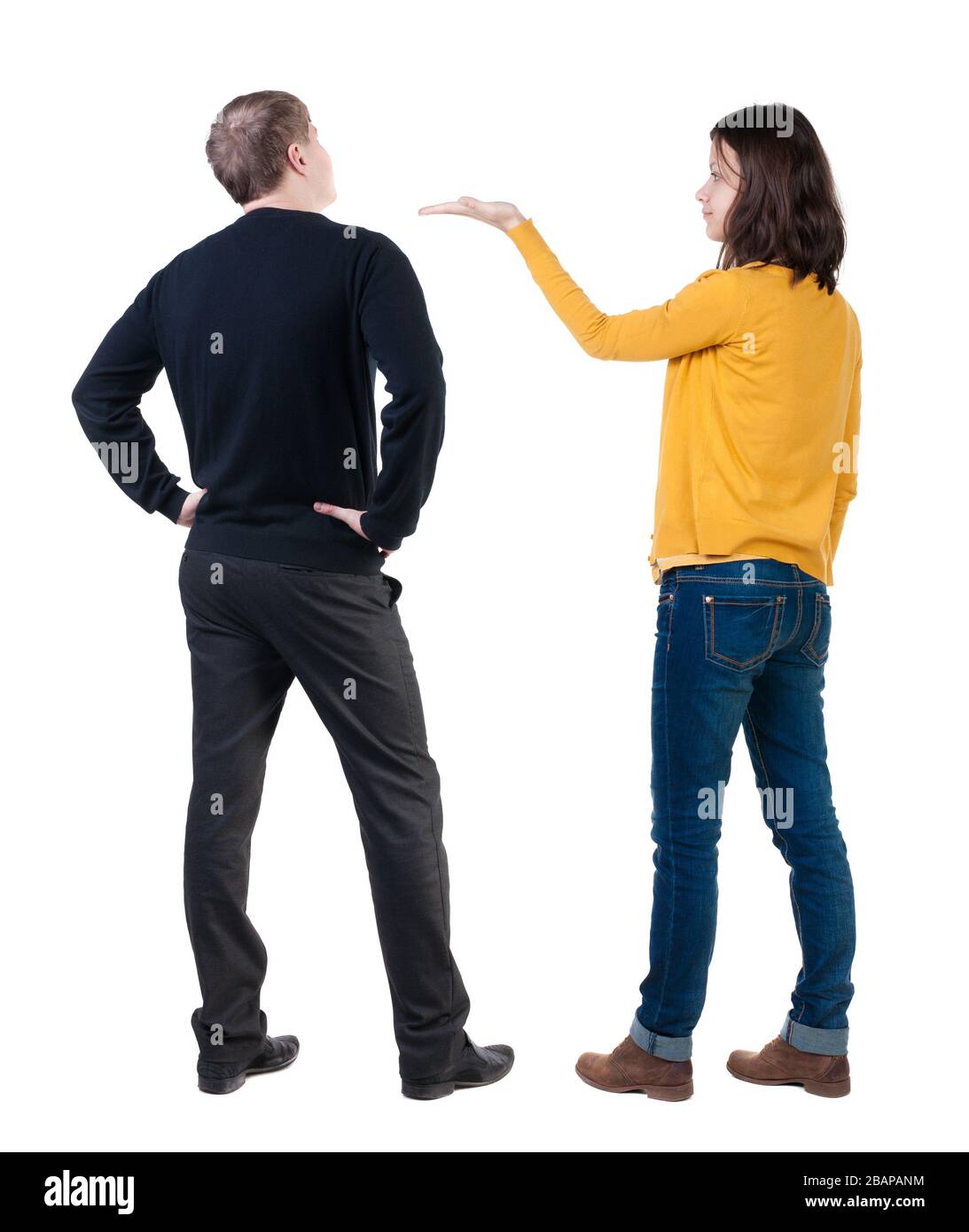 Back view of couple in sweater pointing. Rear view people collection ...