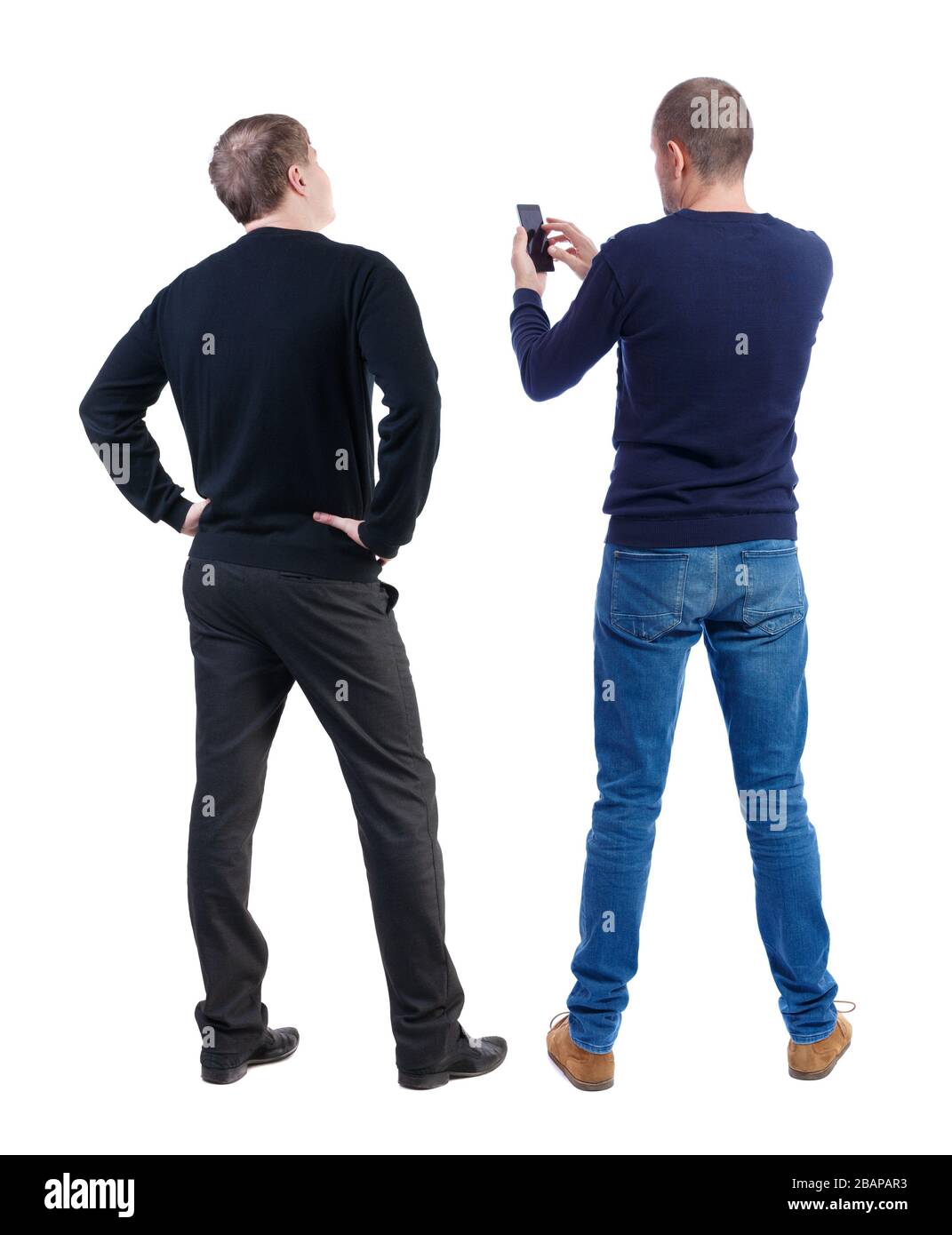 Back view of two man in sweater with mobile phone. Rear view people ...