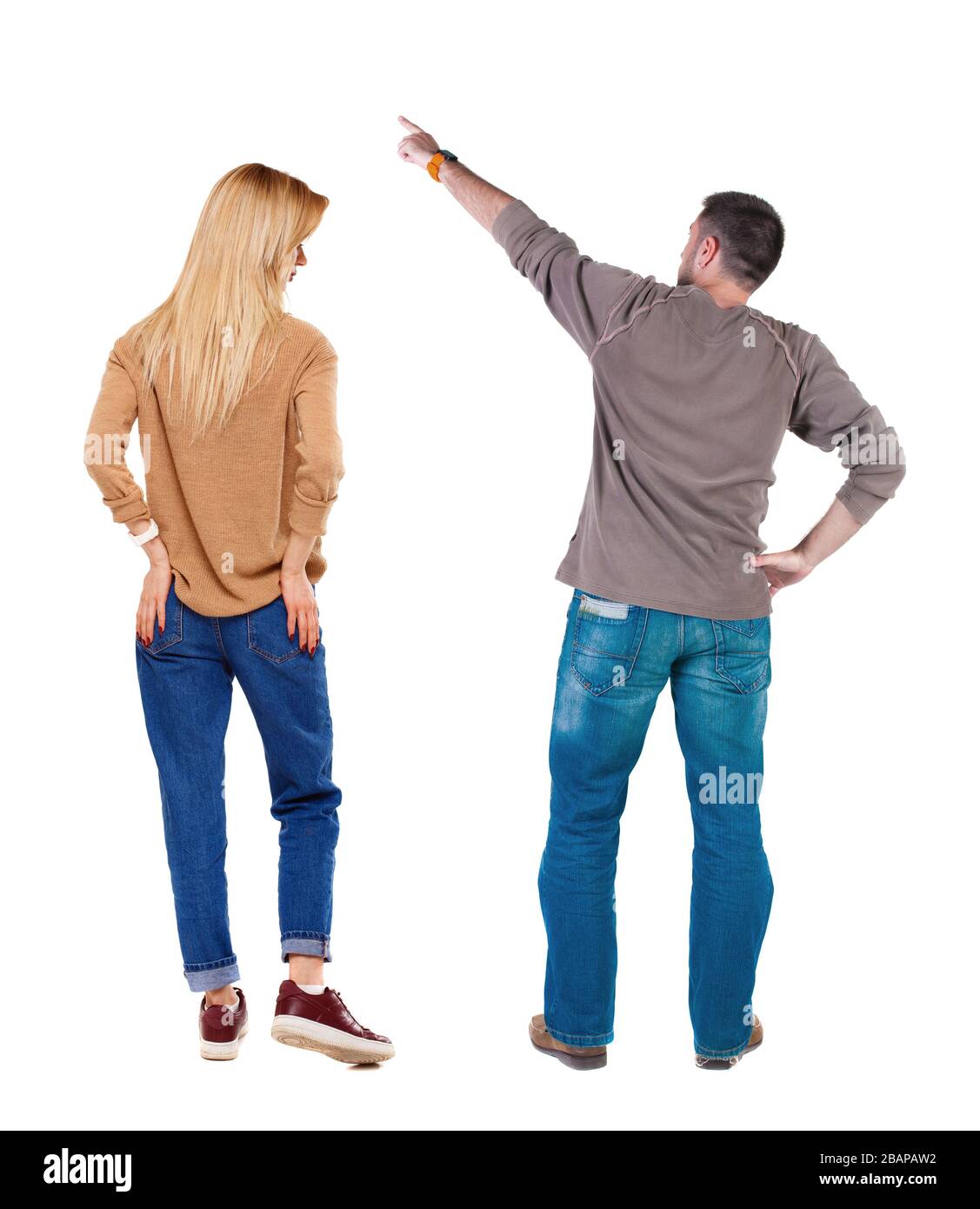 Back view of couple in sweater pointing. Rear view people collection ...