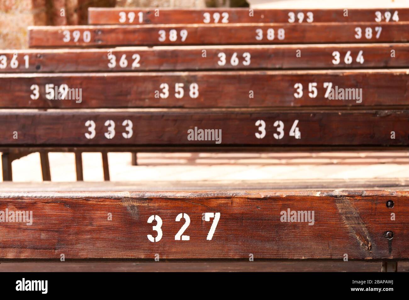 Stenciled numbers on wooden benches. (Focus on the first number Stock ...