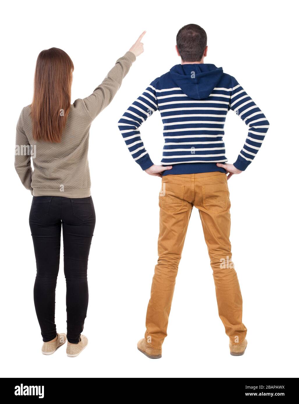 Back view of couple in sweater pointing. Rear view people collection ...
