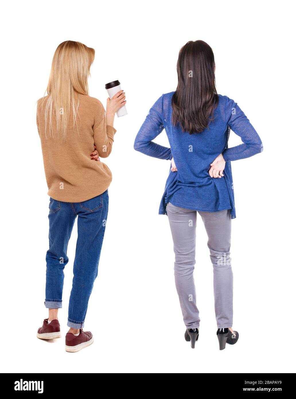 Back view of two woman in sweater. Rear view people collection ...