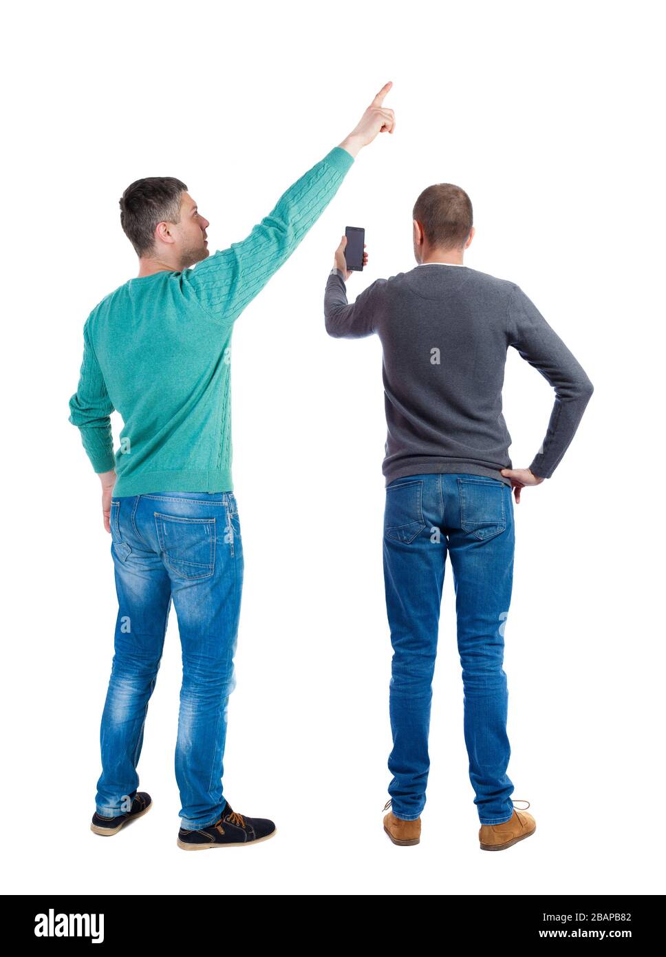 Back view of two man in sweater with mobile phone. Rear view people ...