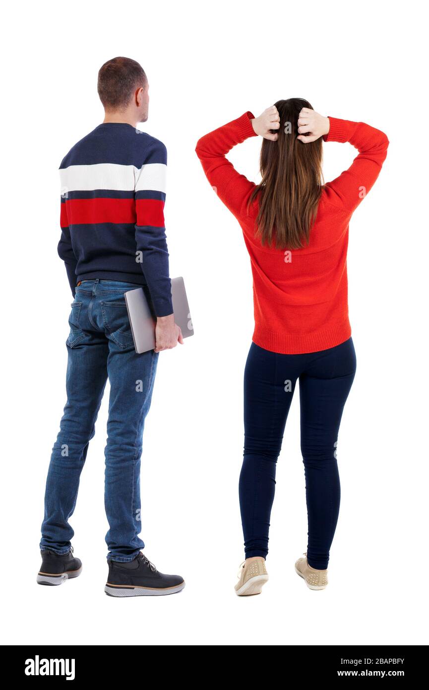 Back view couple with laptop in sweater. beautiful man and woman. Rear ...