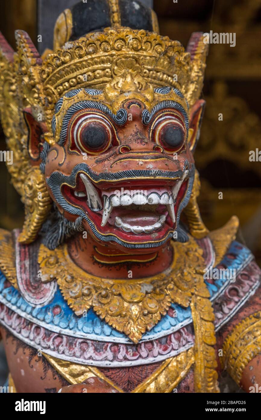 Beautiful, religious carvings depicting Hindu gods painted in green ...