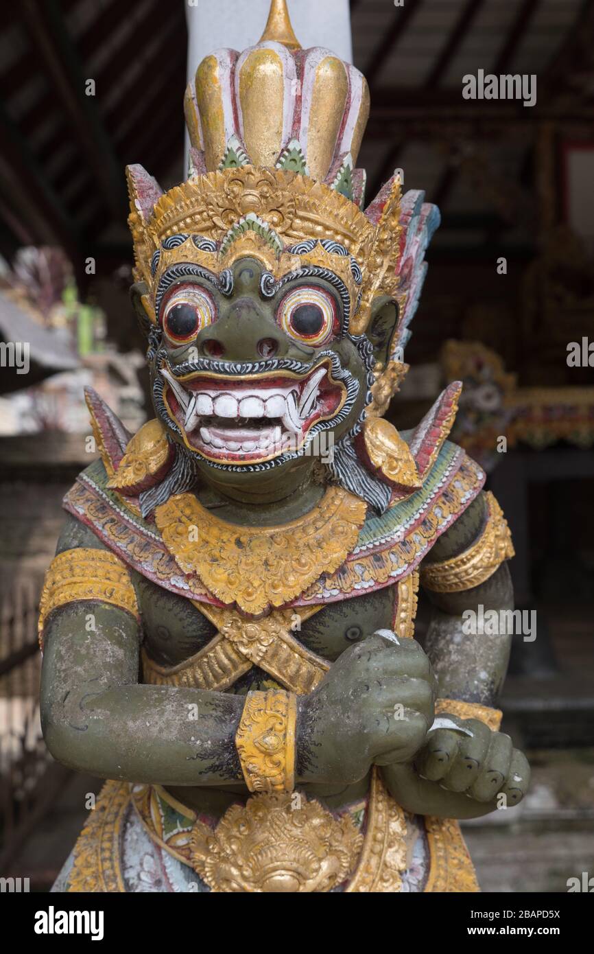 Beautiful, religious carvings depicting Hindu gods painted in green ...