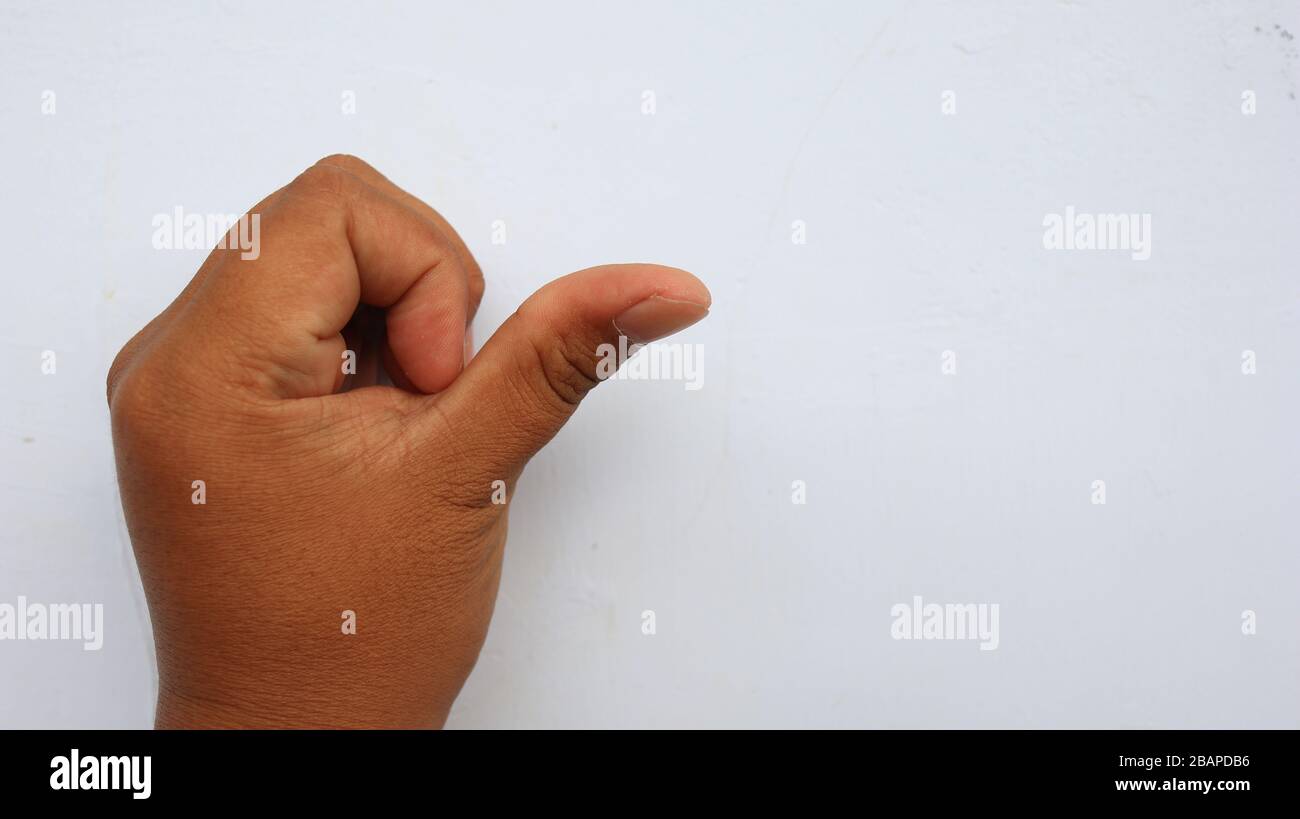 Left hand photographed with the meaning of a symbol and white ...