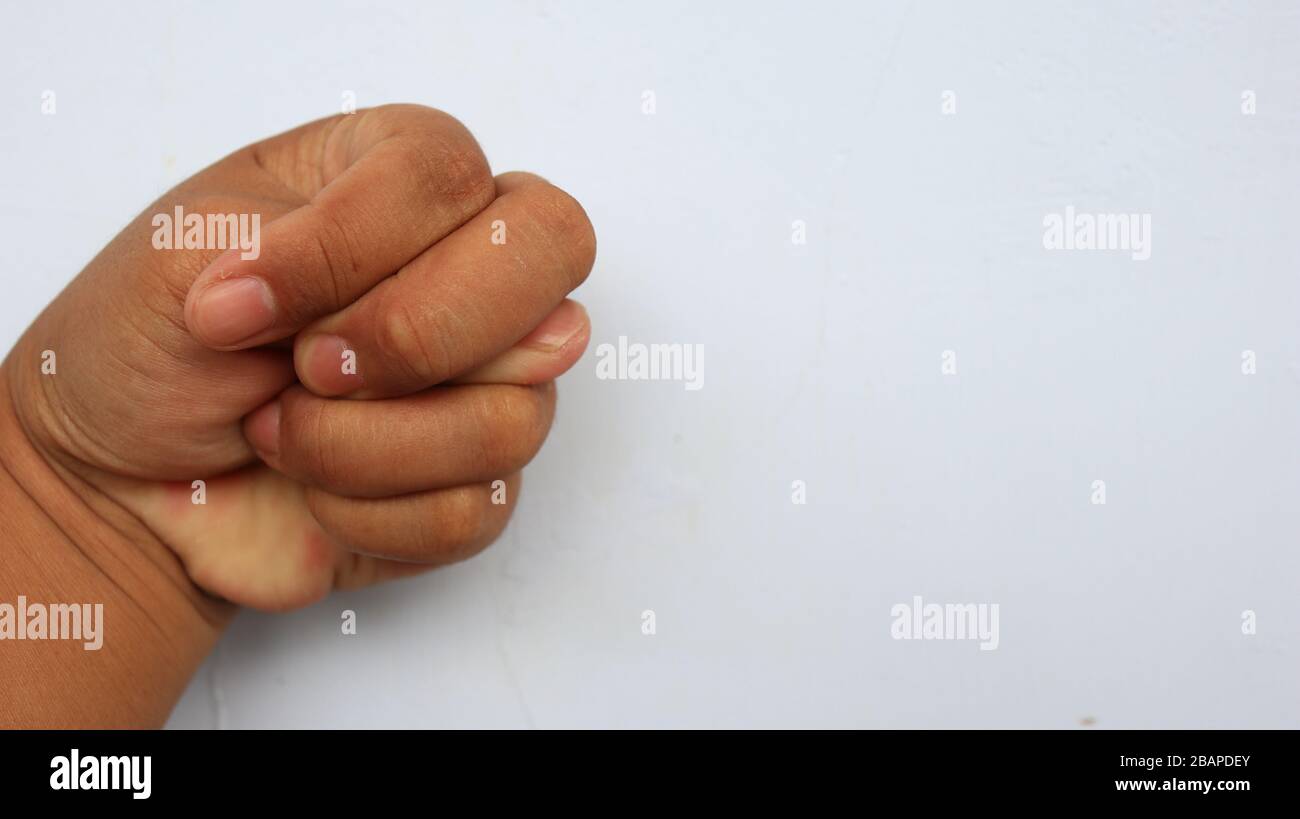 Left hand photographed with the meaning of a symbol and white ...