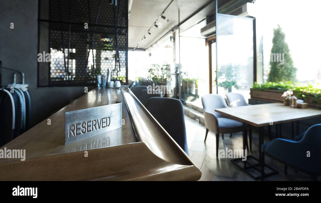 Reserved table in modern cafe or restaurant with panoramic windows ...