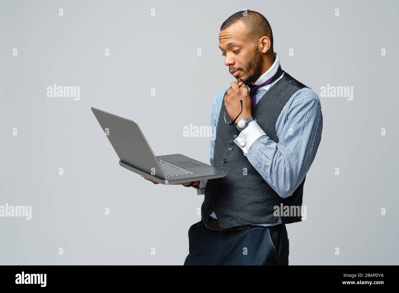 professional african-american business man holding laptop computer ...