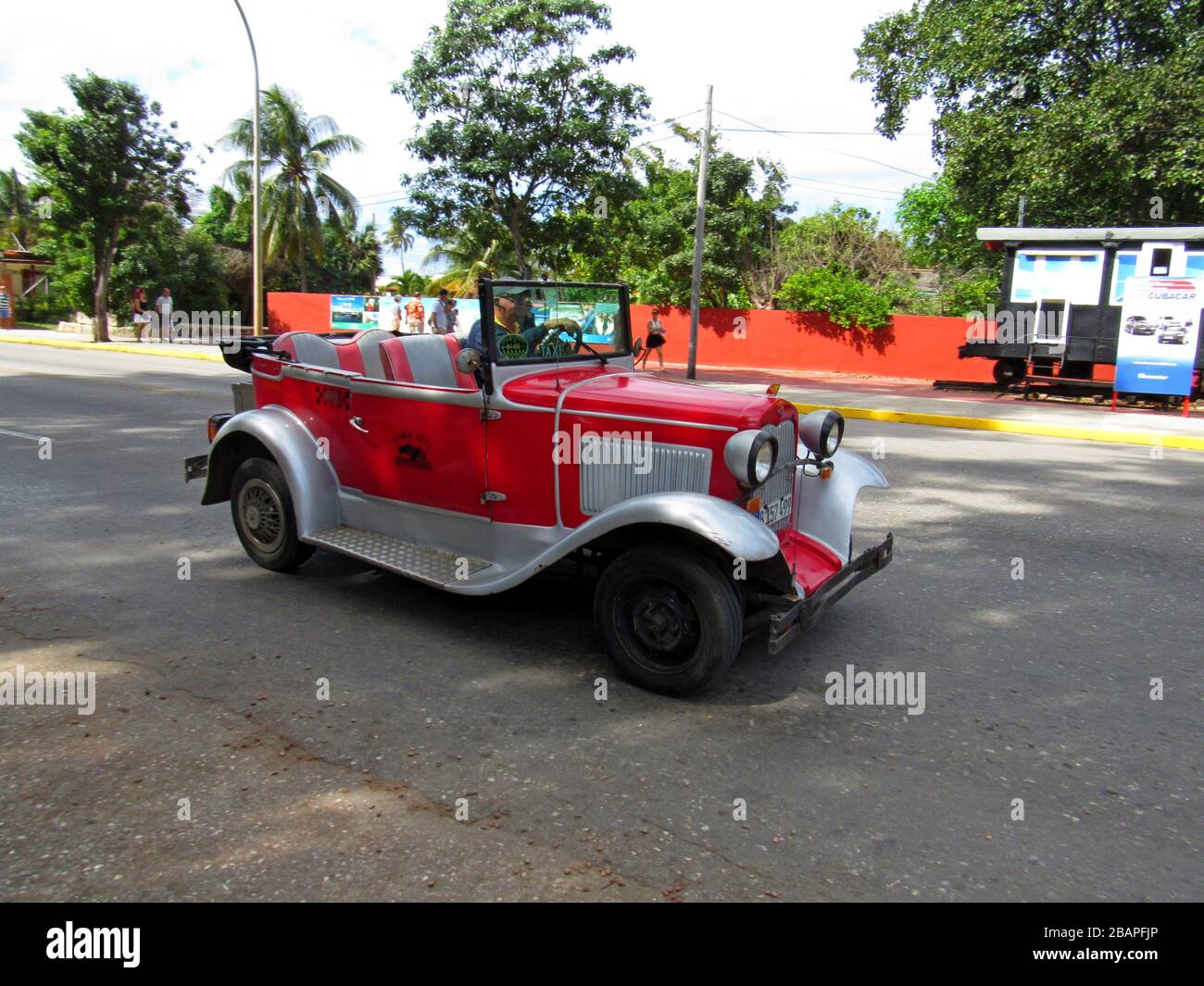 American convertible vintage cars parked on the main street in Varadero ...