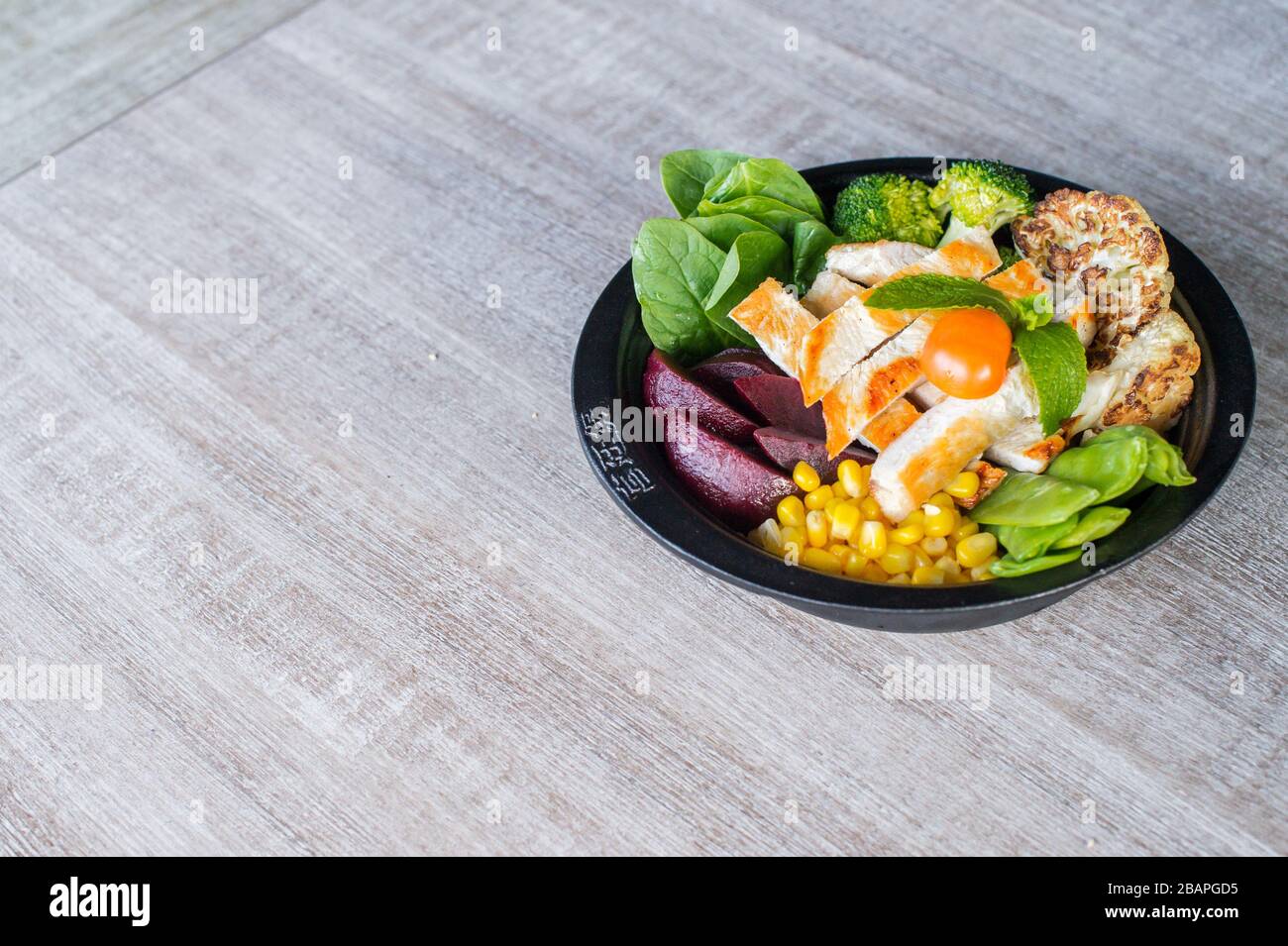 Chicken on entree on rustic table Stock Photo - Alamy