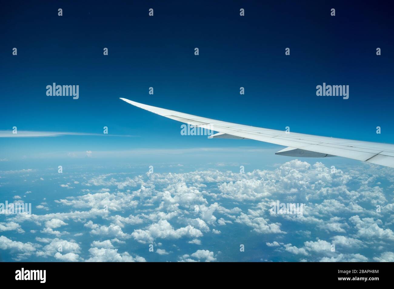 Aircraft flying above the cloud and blue sky. Nice view from the ...