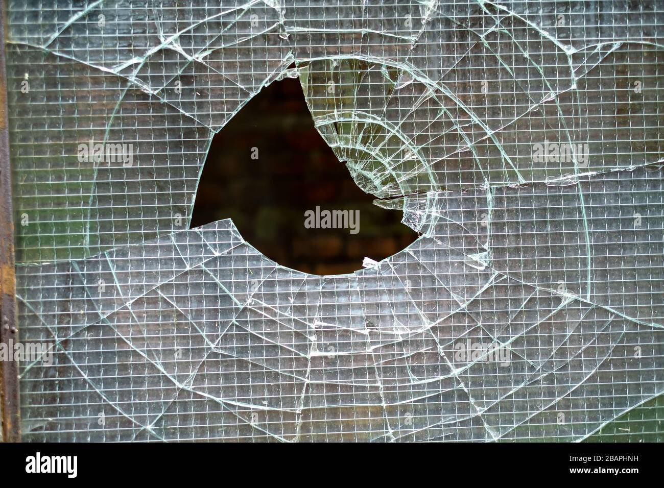 Broken glass in the window of industrial warehouse Stock Photo - Alamy