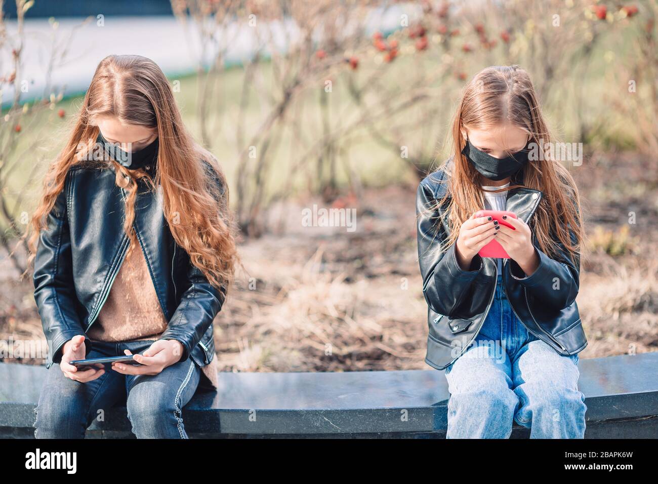Girls wearing a mask on a background of a modern building Stock Photo ...