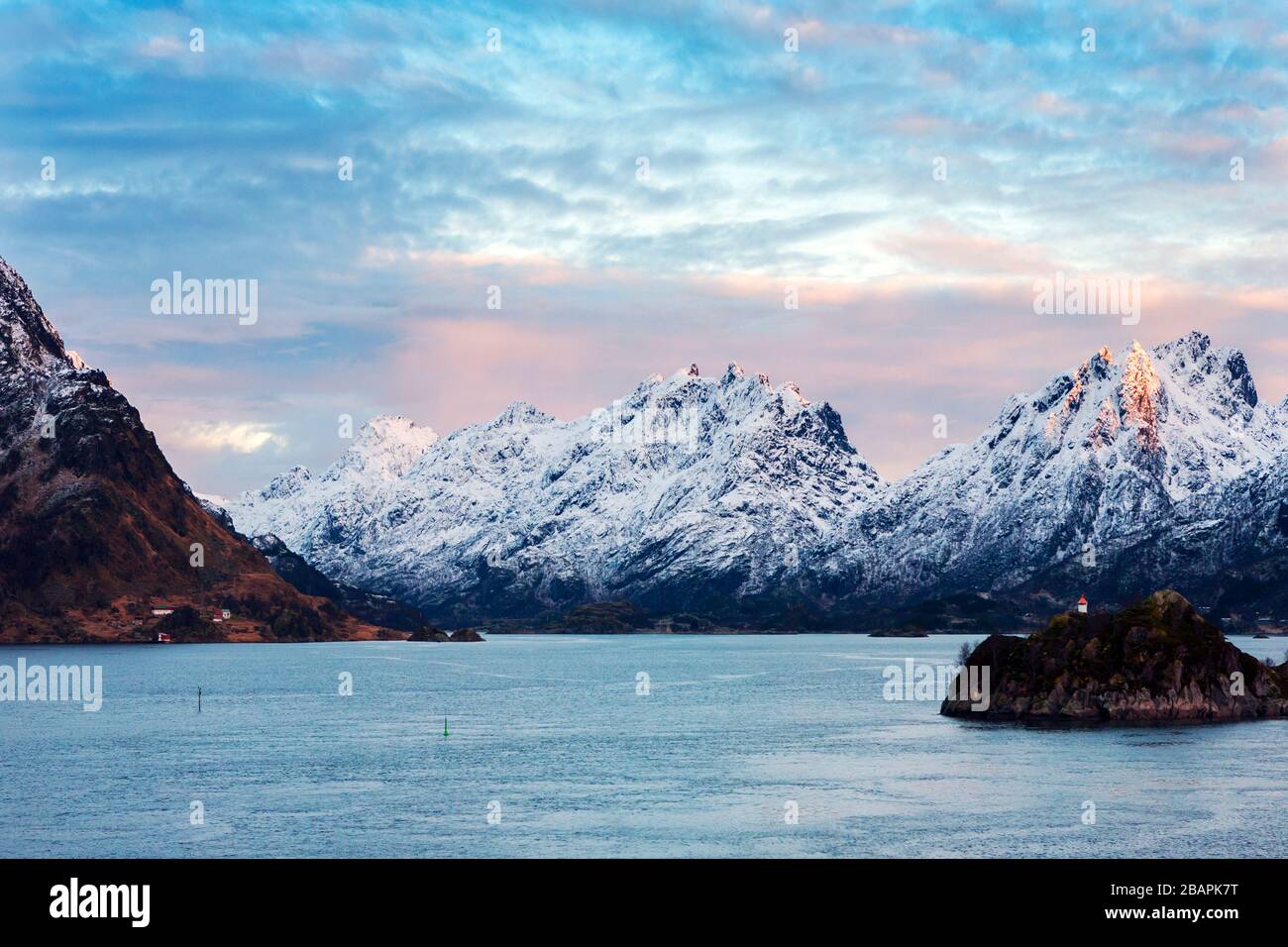 The entrance to the Ingelsfjorden, Hinnøya, surrounded by snowy peaks ...