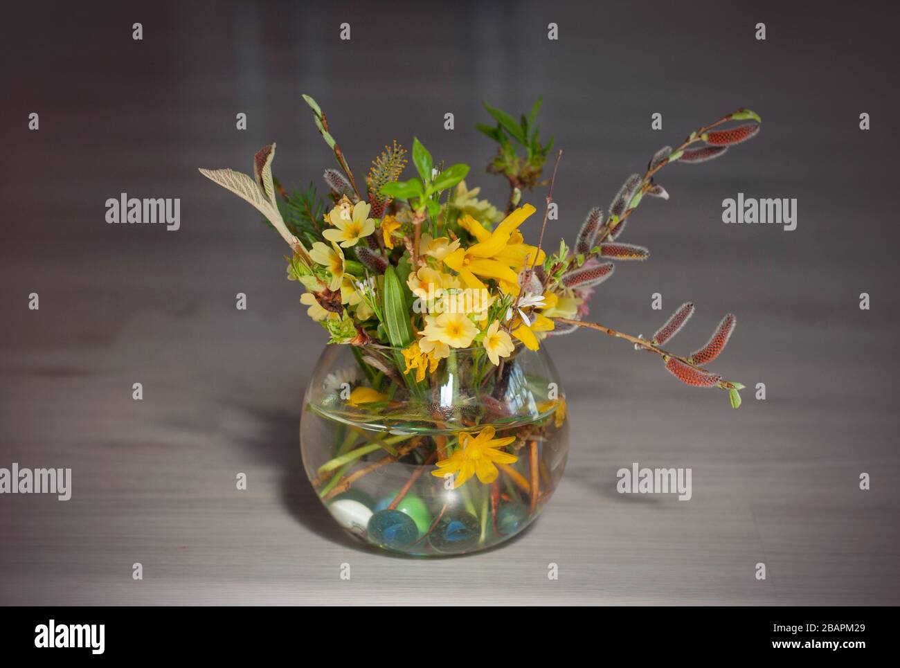 Bouquet of mixed spring flowers and blooming spring flowers in a little ...