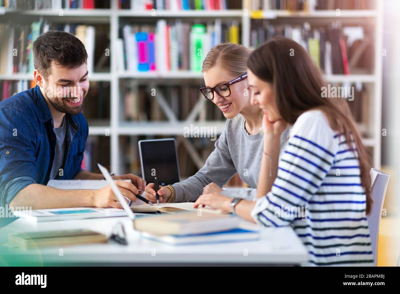 University students working in the library at campus Stock Photo - Alamy
