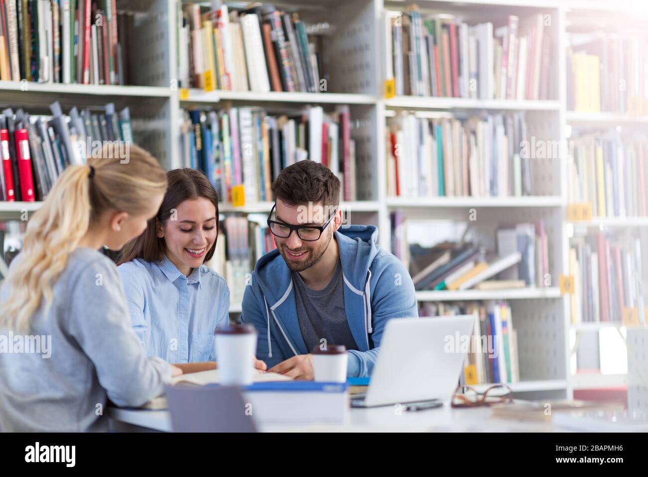 University students working in the library at campus Stock Photo - Alamy