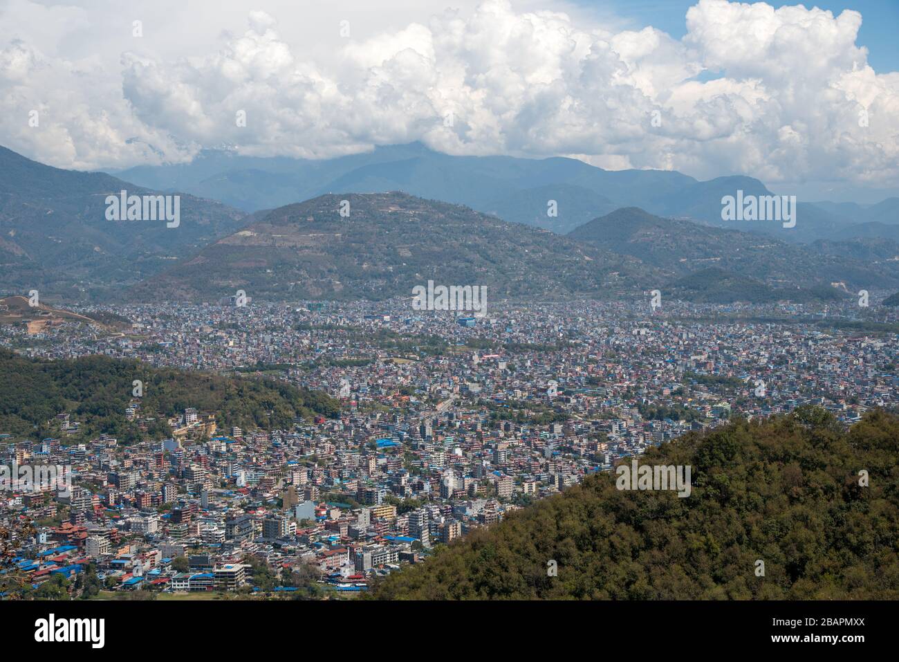 The cityscape of Pokhara with the Annapurna mountain range covered in ...