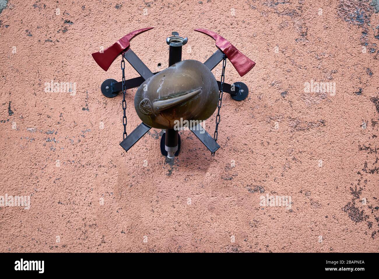 Crossed fire axes hanging in front of a fire station Stock Photo - Alamy