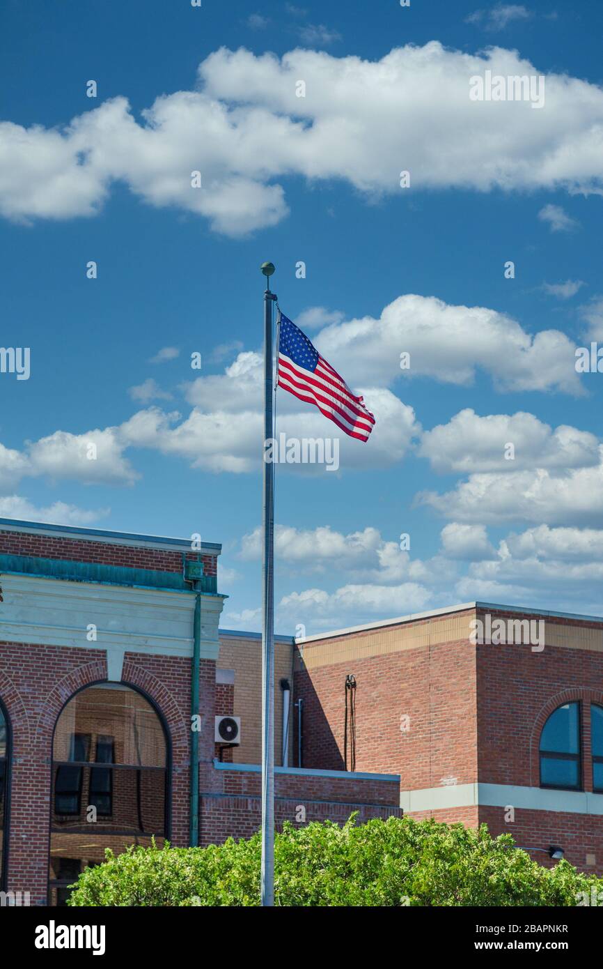 American Flag in Front of Brick Building Stock Photo - Alamy