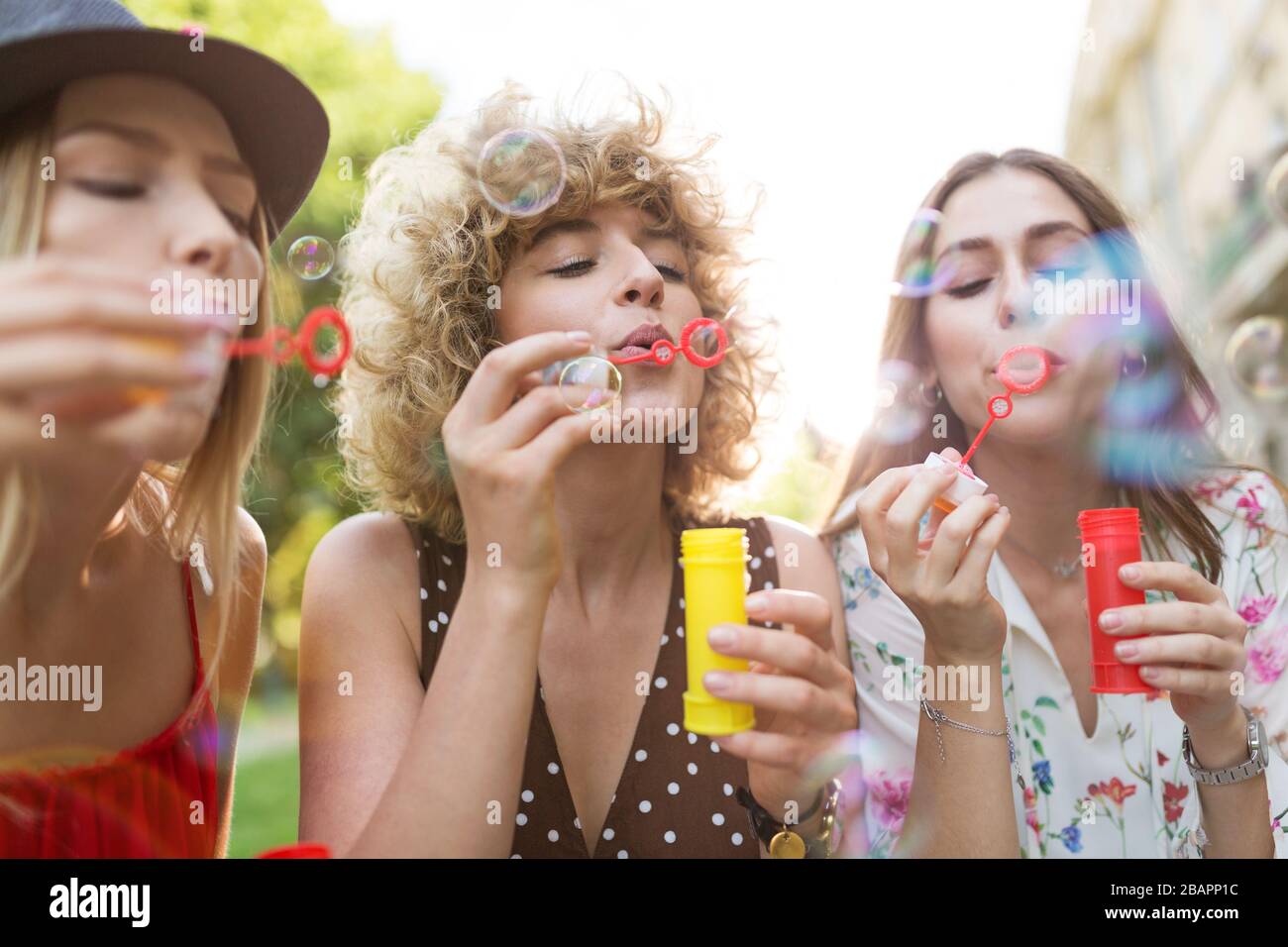 Girls blowing bubbles together hi-res stock photography and images - Alamy