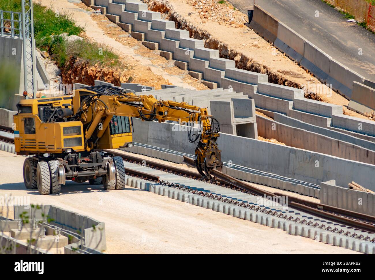 Rail excavator on reconstruction of the railway rails Stock Photo - Alamy