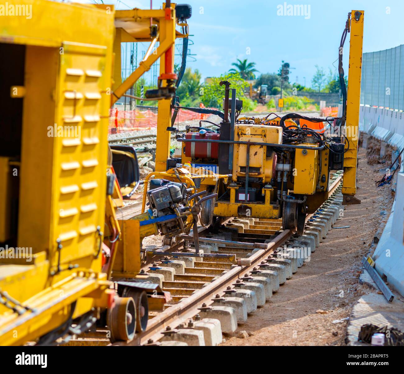 Rail excavator on reconstruction of the railway rails Stock Photo - Alamy