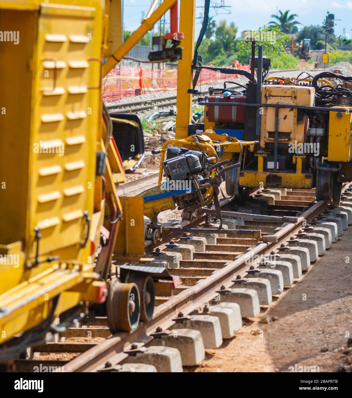 Rail excavator on reconstruction of the railway rails Stock Photo - Alamy
