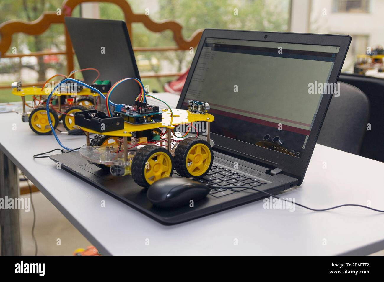 Robor and laptop on the table classroom. Robotics Stock Photo - Alamy