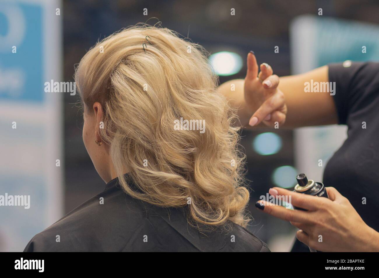 Professional barber using hairspray styling hi-res stock photography ...