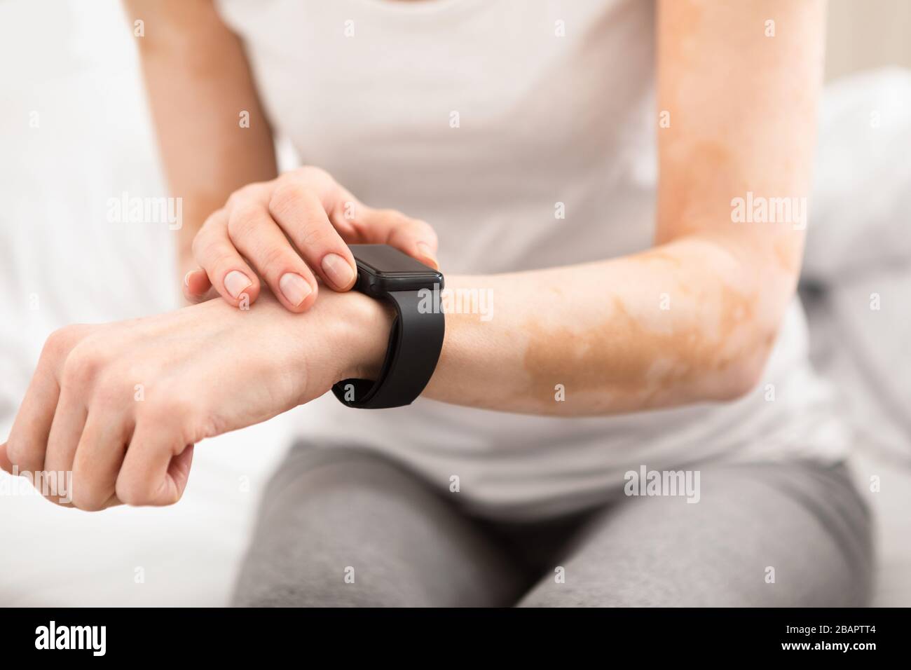 Woman with modern watches measuring pulse on hand Stock Photo - Alamy